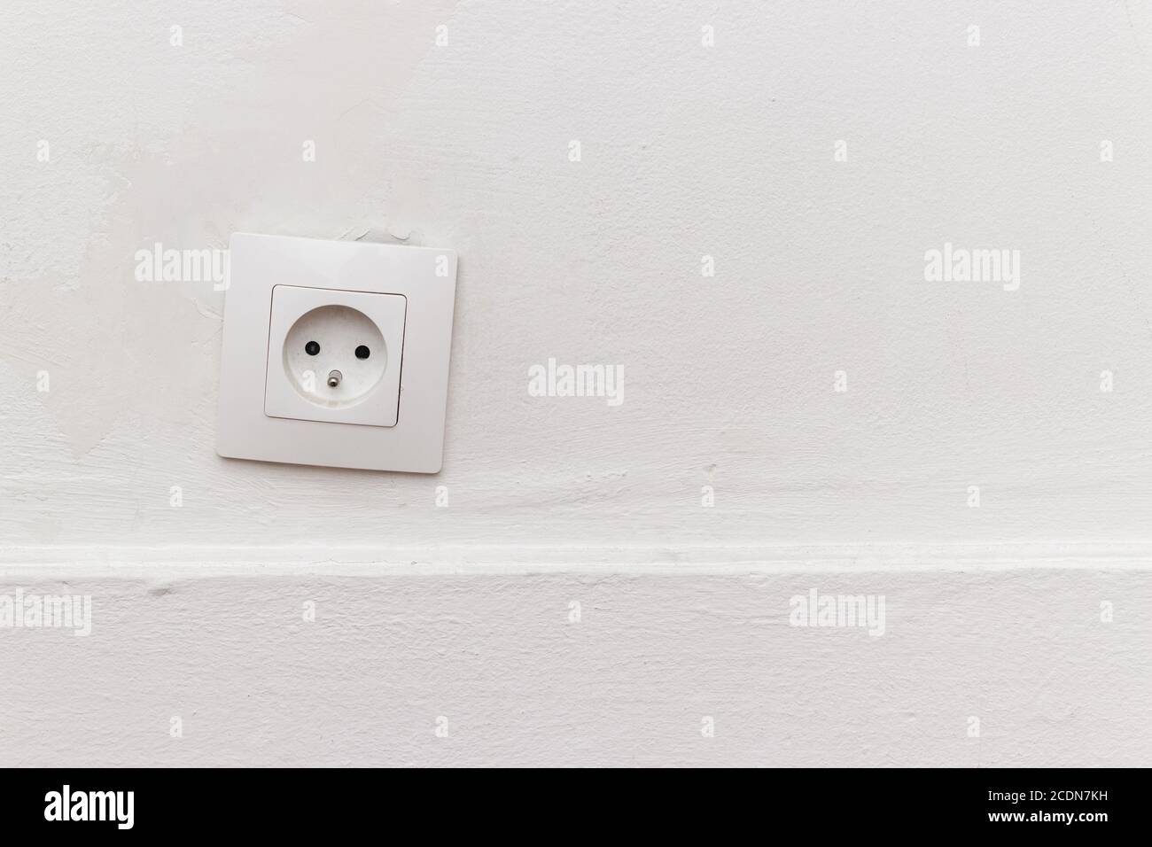outlet on the white wall Stock Photo - Alamy