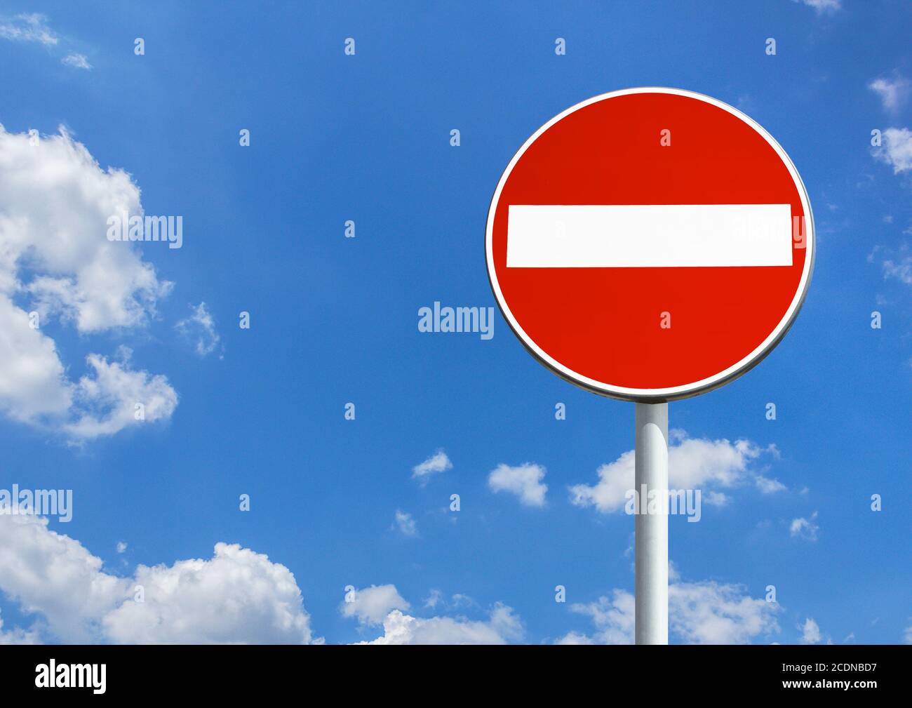 No entry sign against blue sky with copy space Stock Photo - Alamy