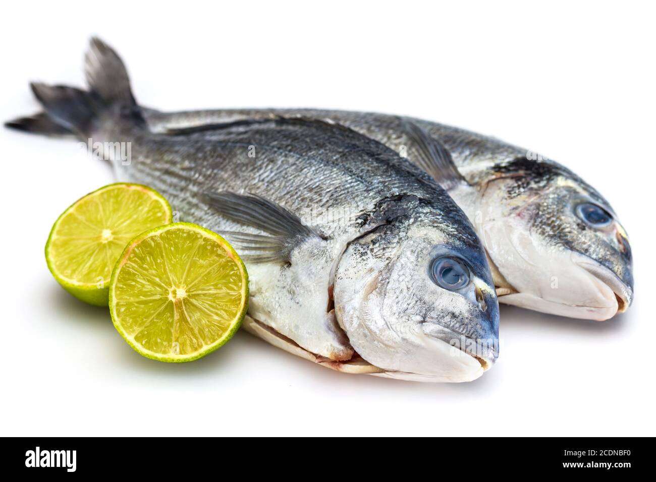 Bream fish with lime isolated on white background Stock Photo - Alamy