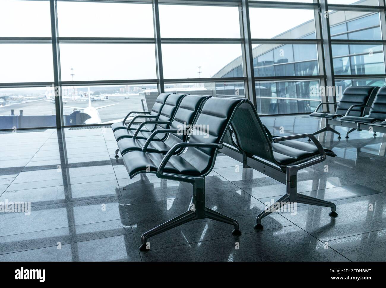 airport waiting area , seats and outside the window scene Stock Photo ...