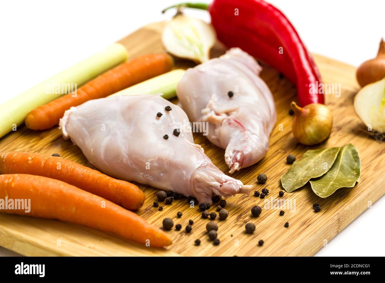Raw rabbit with black pepper and allspice Stock Photo - Alamy