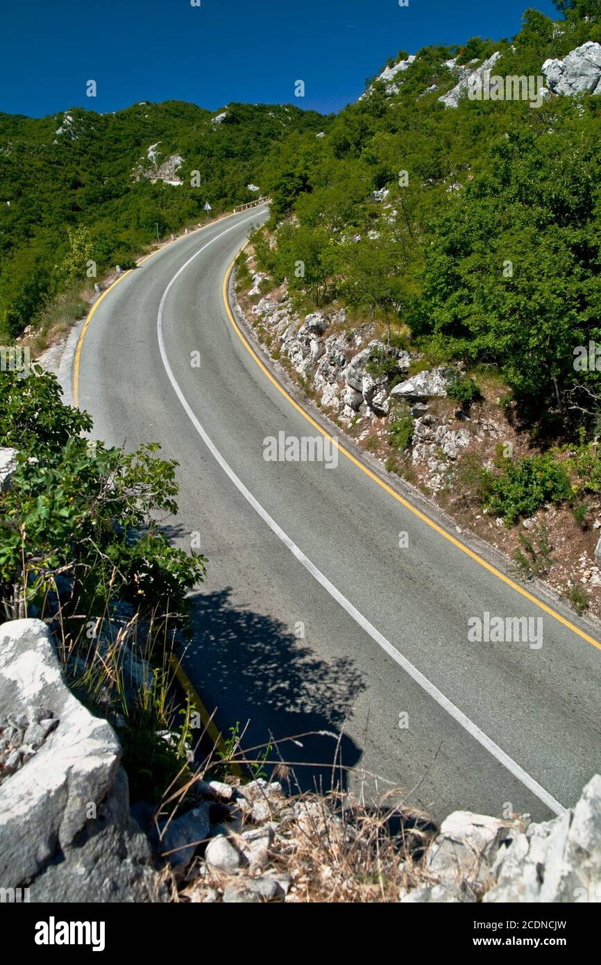 A scenic and winding road between mountains, leading to the top Stock ...