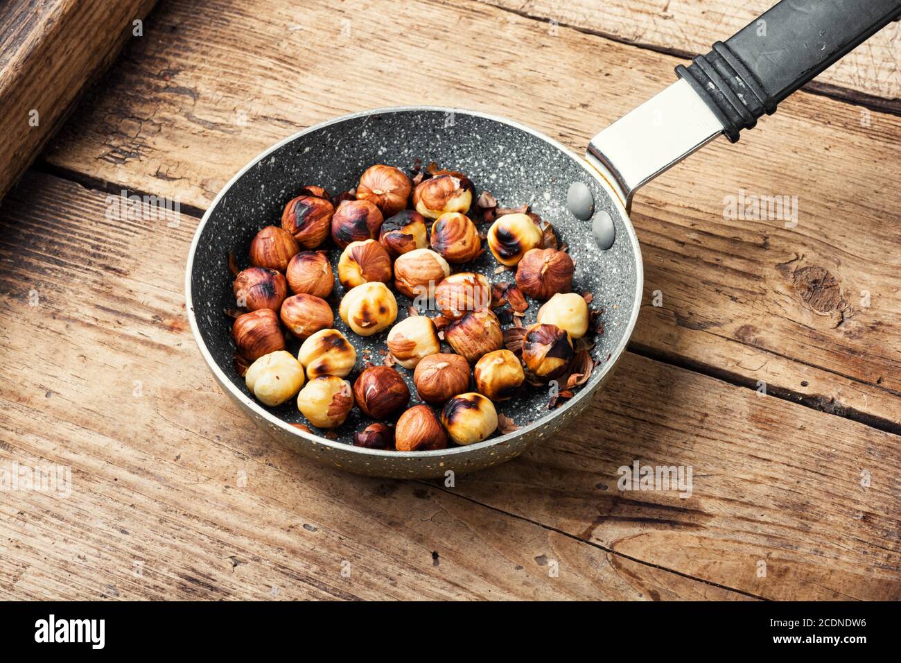 Pile of roasted peeled hazelnuts.Hazelnut fried in a frying pan Stock ...