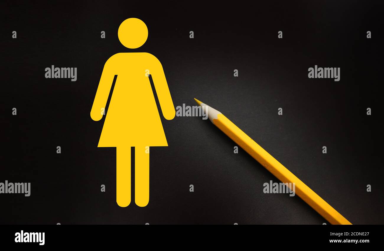 Woman icon and yellow pencil on black. Gender issues and woman rights ...