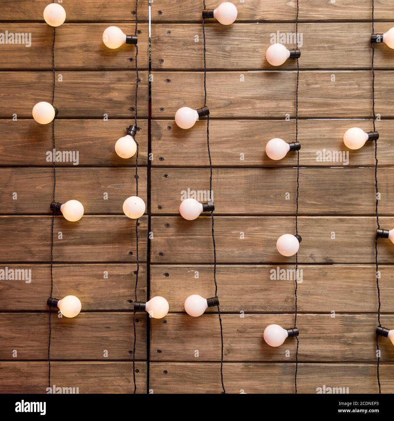 Wood wall with edison light bulb Stock Photo - Alamy