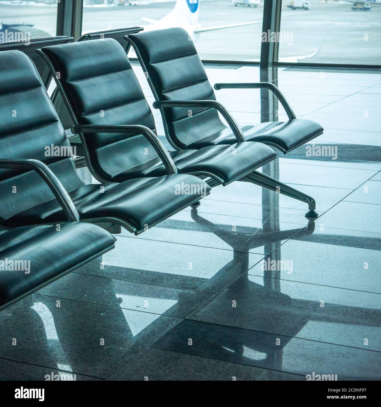 airport waiting area , seats and outside the window scene Stock Photo ...