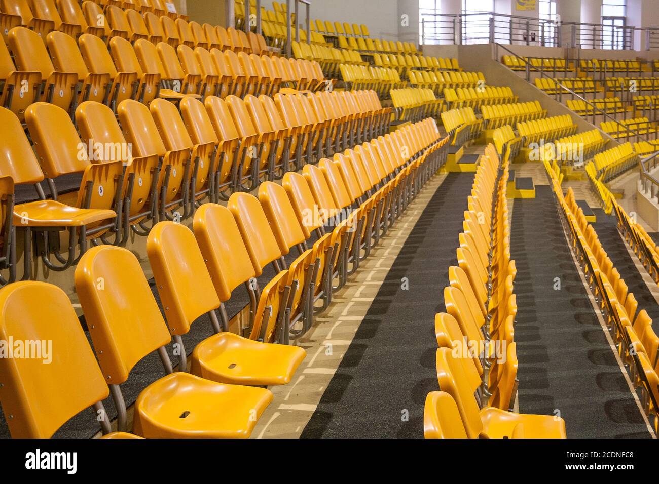 Yellow stadium seats Stock Photo - Alamy