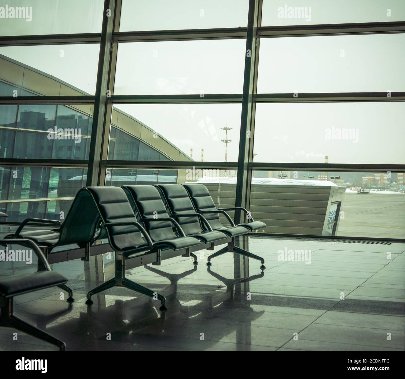 airport waiting area , seats and outside the window scene Stock Photo ...