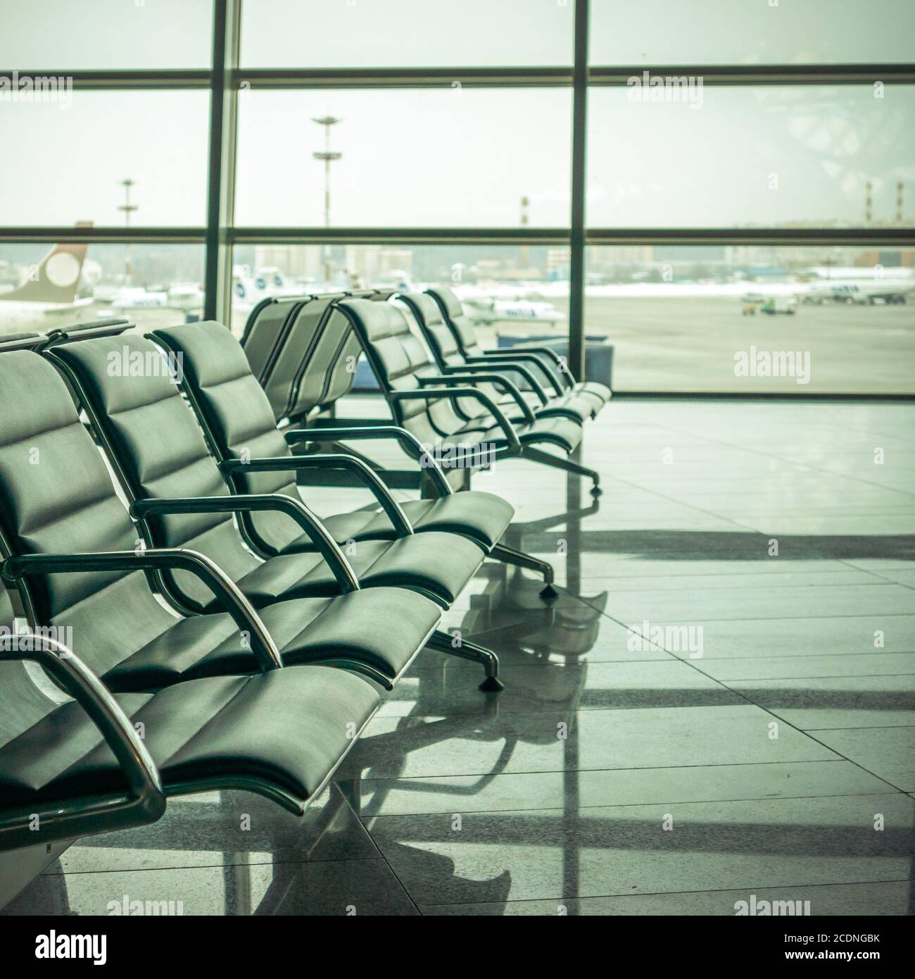 airport waiting area , seats and outside the window scene Stock Photo ...
