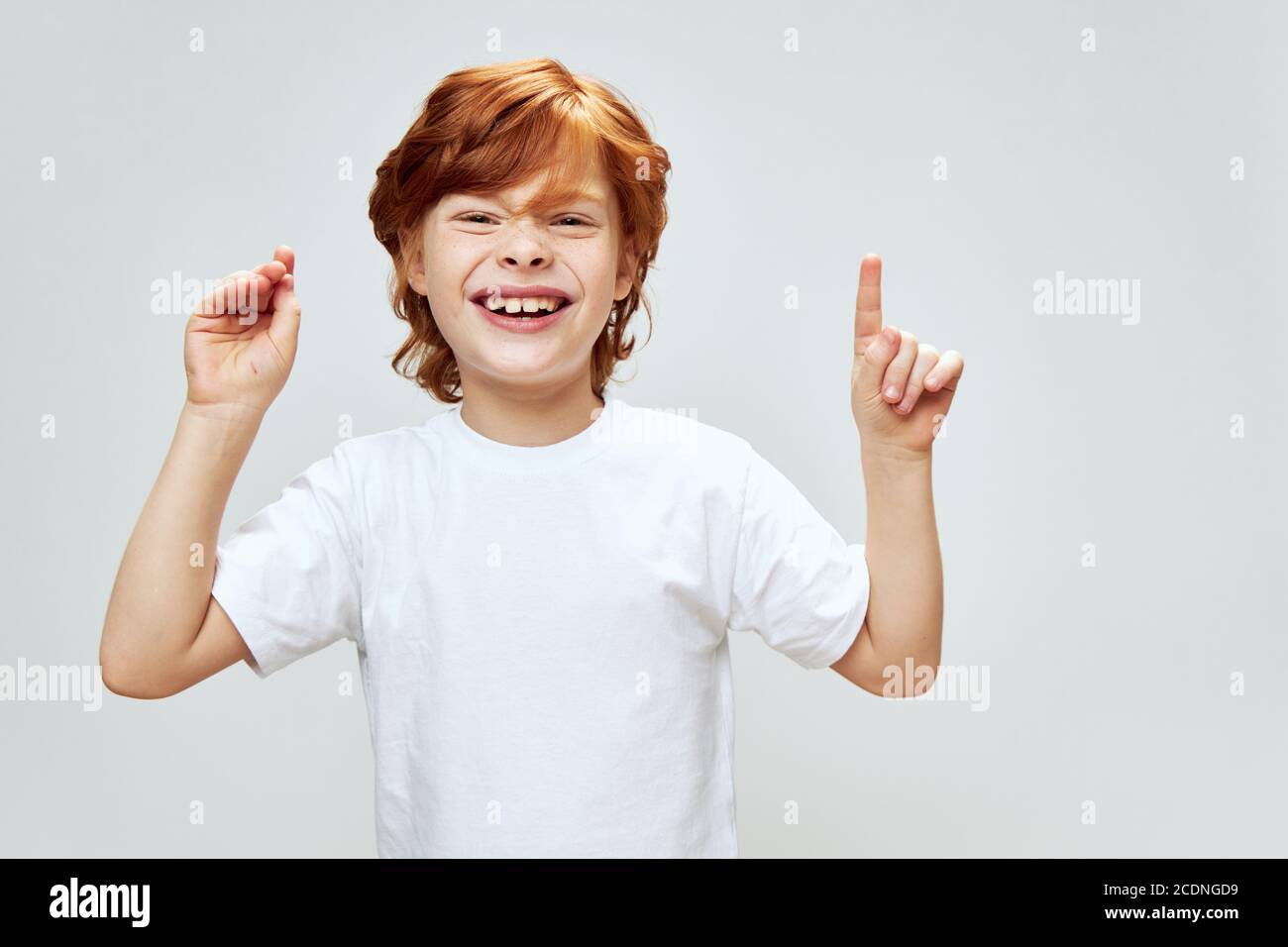 Happy boy pointing up and laughing Copy Space Stock Photo - Alamy