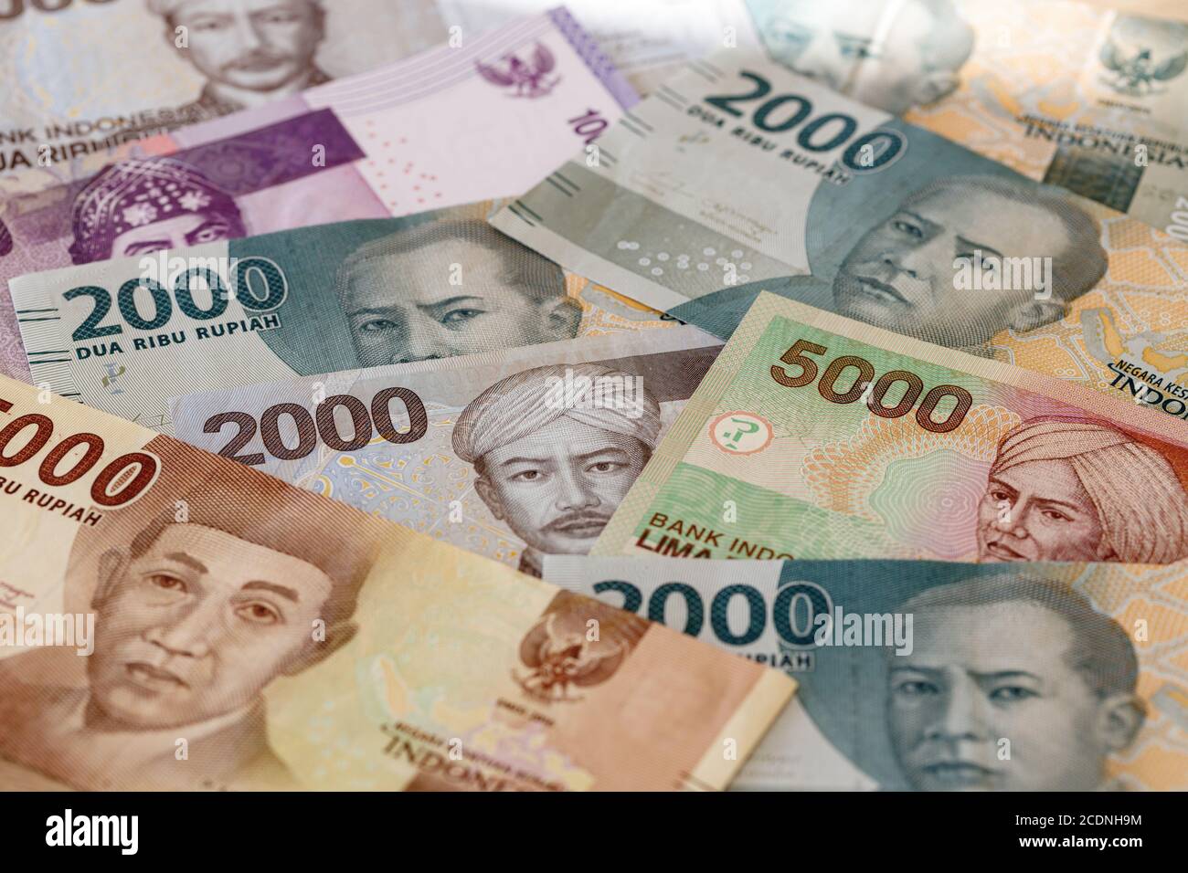 Indonesian banknotes, Different denominations scattered on the table ...