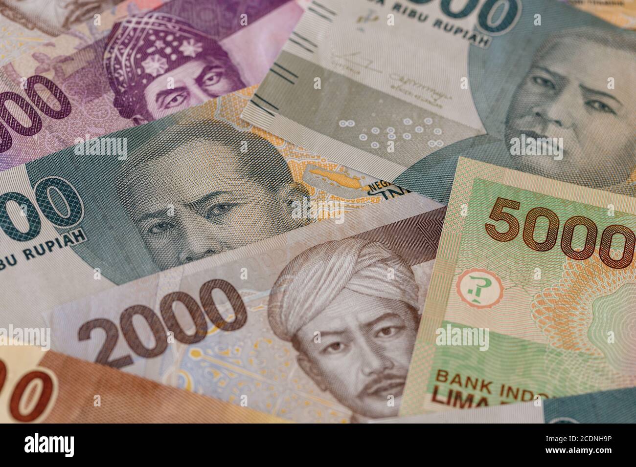 Indonesian banknotes, Different denominations scattered on the table ...