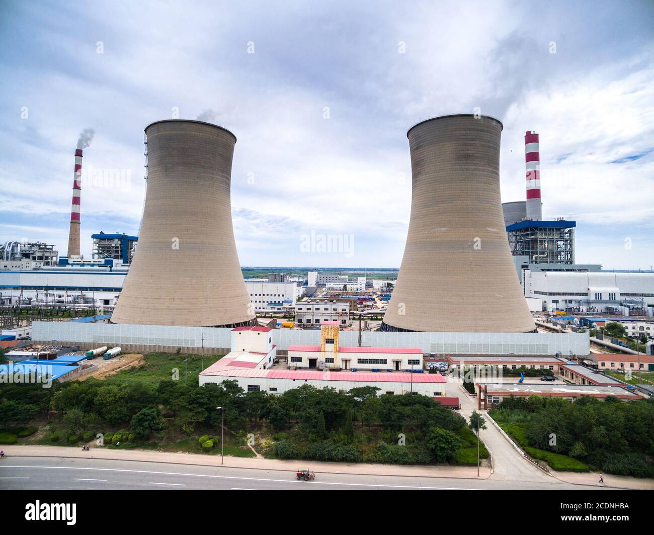 skyline and huge cooling tower in power plant Stock Photo - Alamy