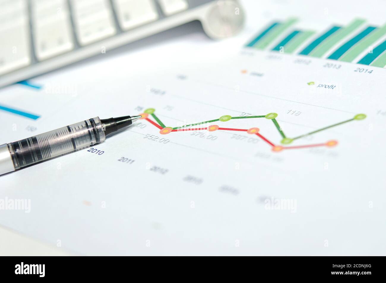 Graphs and pen Stock Photo - Alamy