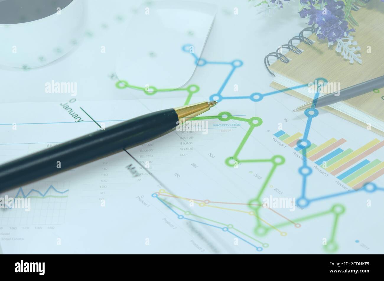 Graphs and pen Stock Photo - Alamy
