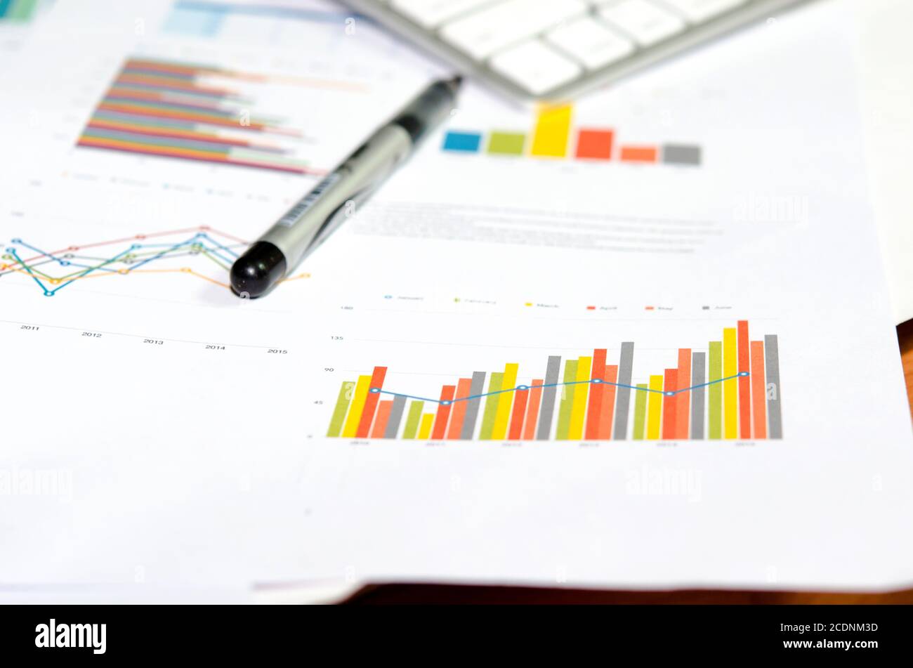 Graphs and pen Stock Photo - Alamy