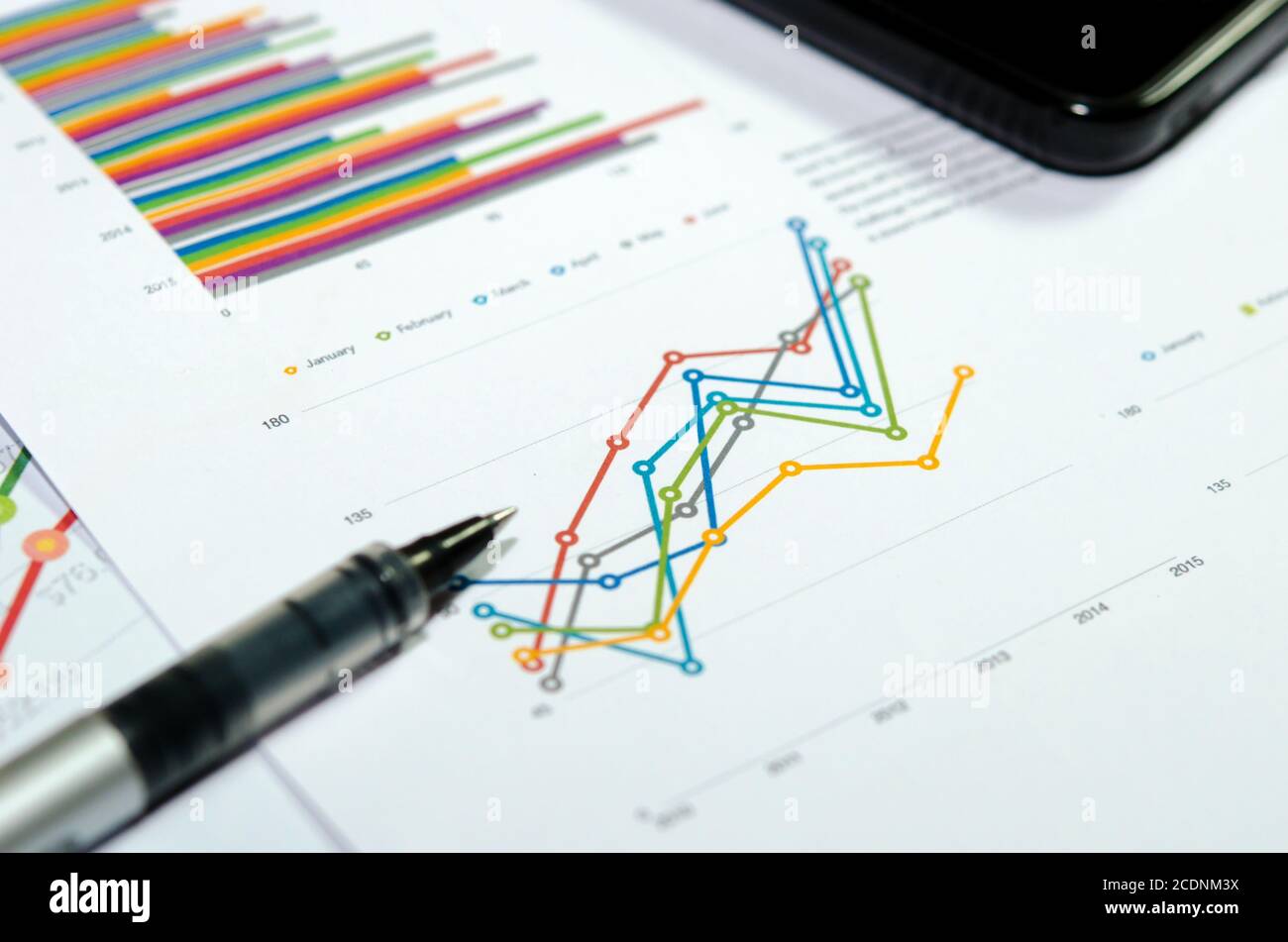 Graphs and pen Stock Photo - Alamy