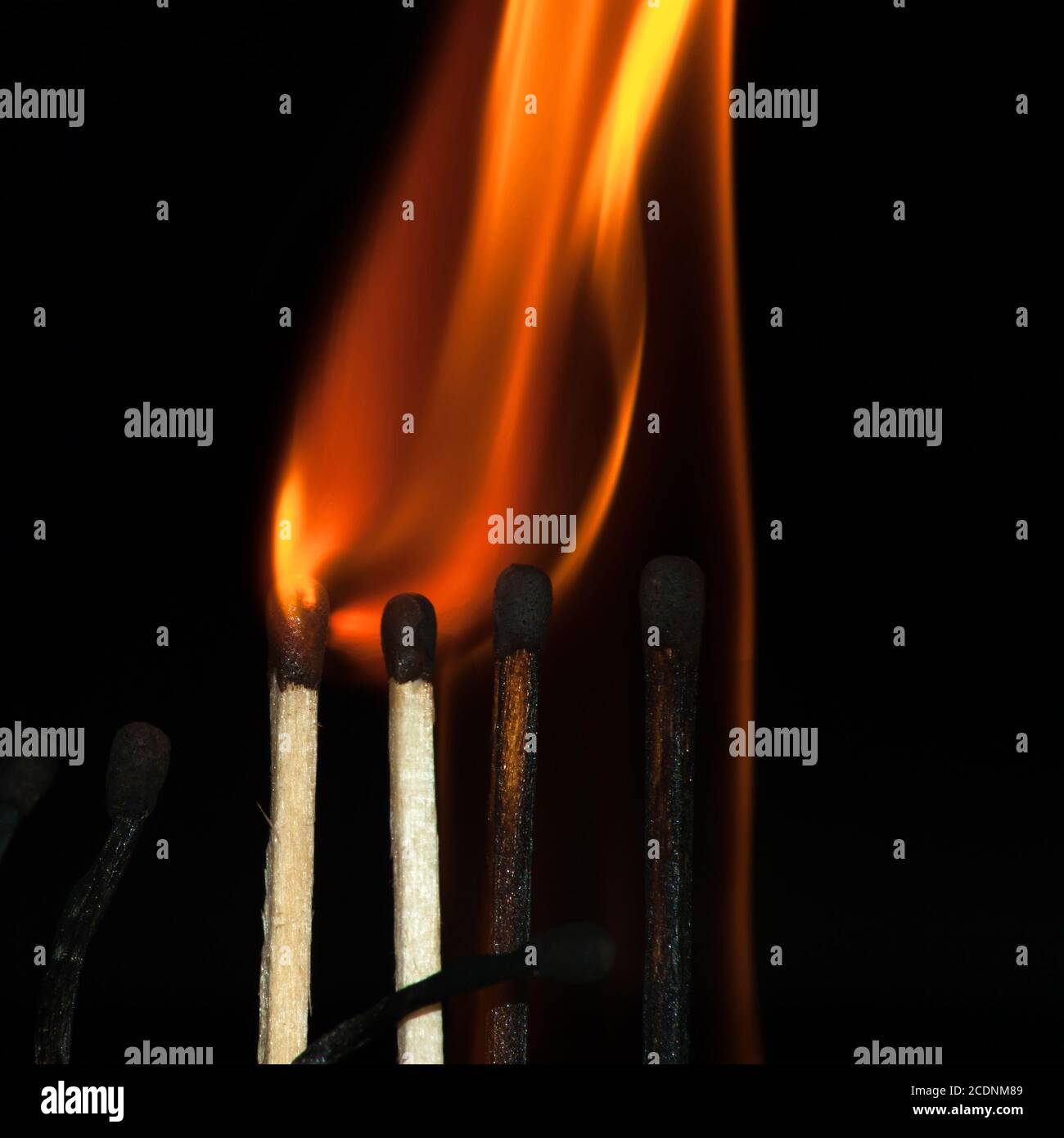 Burning matches on black Stock Photo - Alamy