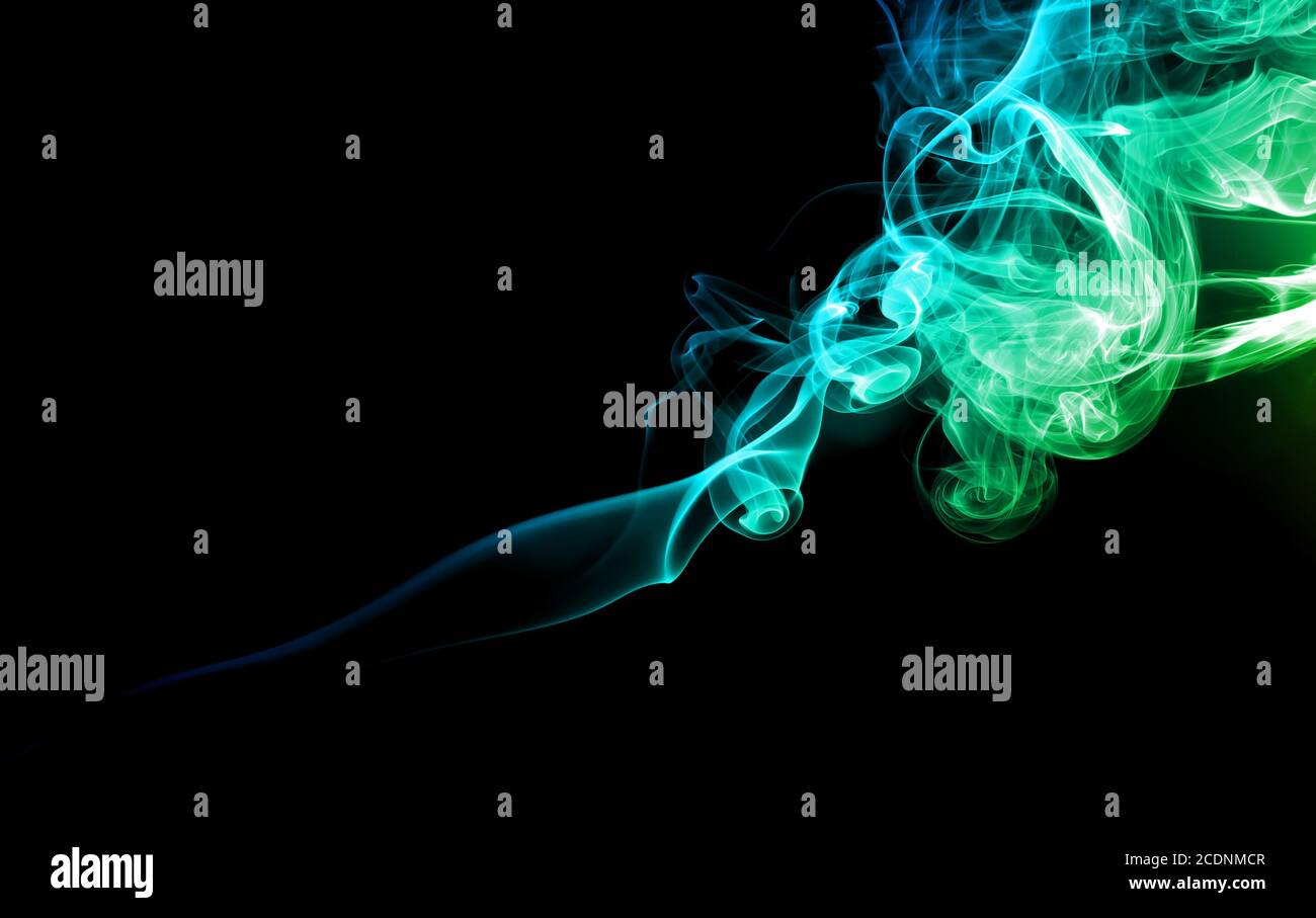 Green and blue smoke on dark Stock Photo - Alamy