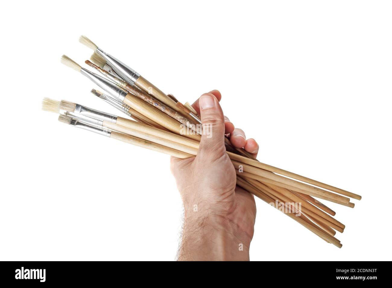 Brushes in hand of the artist Stock Photo - Alamy