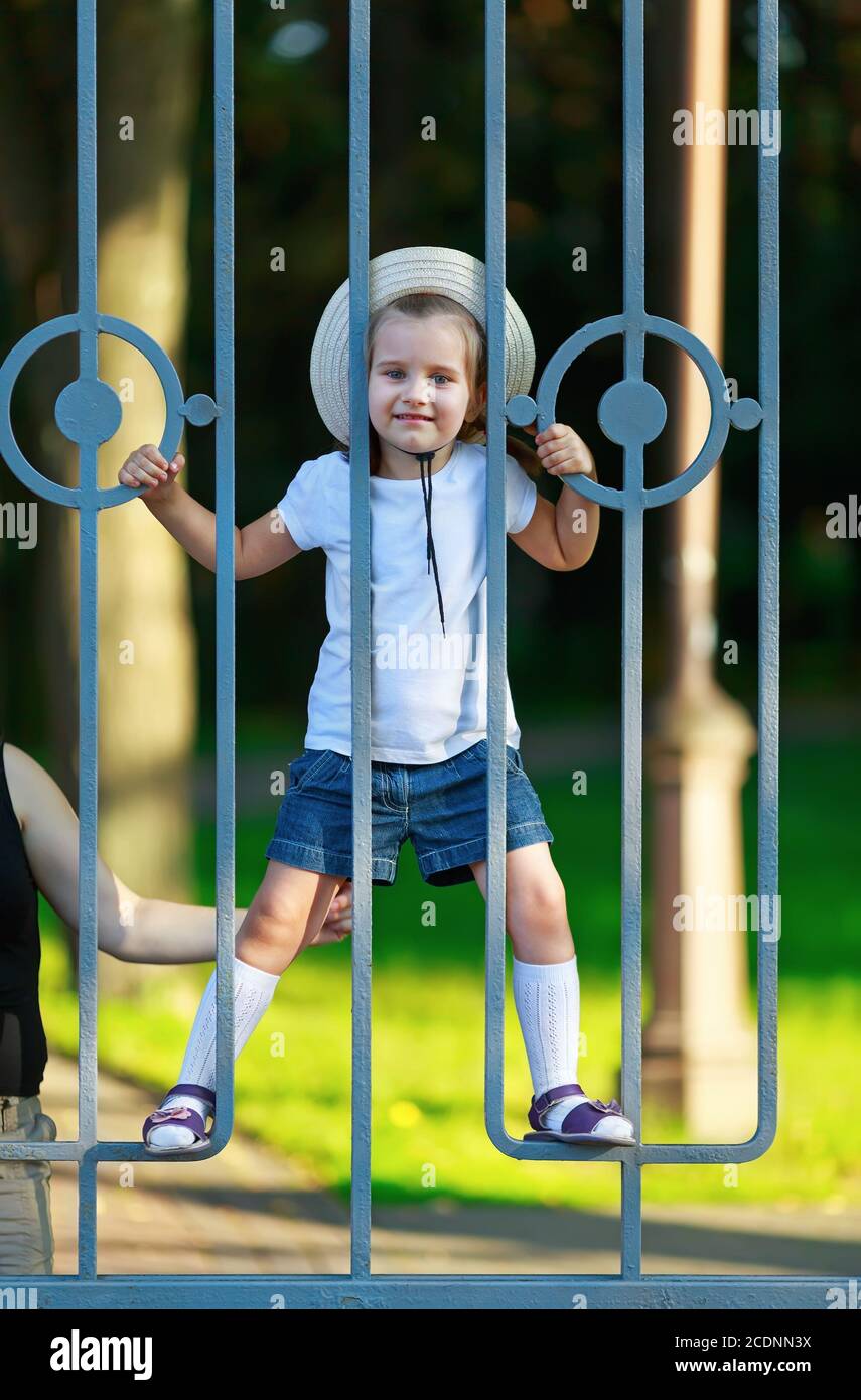 Child behind a fence Stock Photo - Alamy