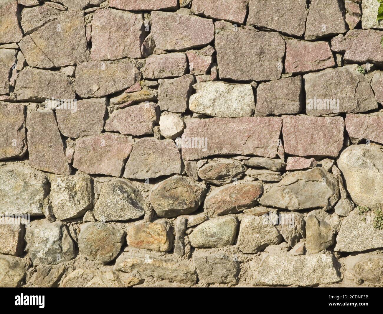 stone wall reddish Stock Photo - Alamy