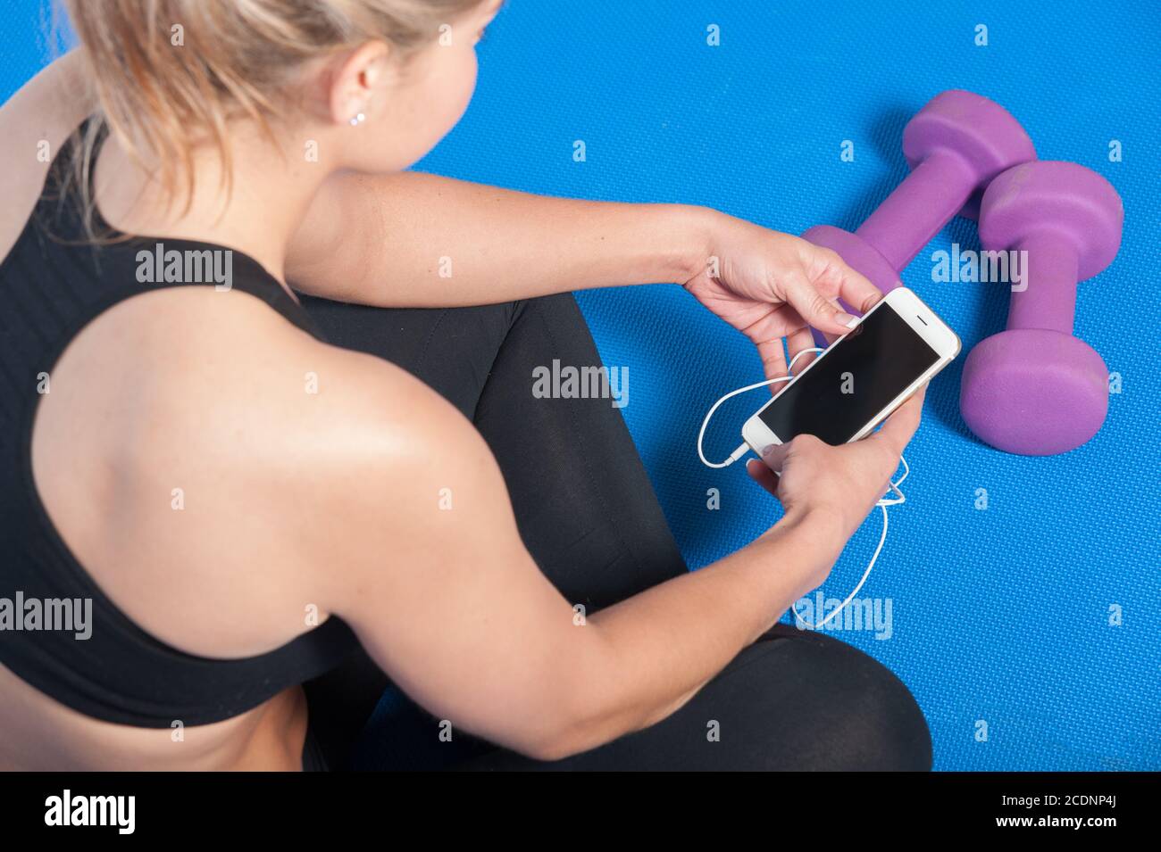 Female fitness model resting after an intense workout Stock Photo - Alamy