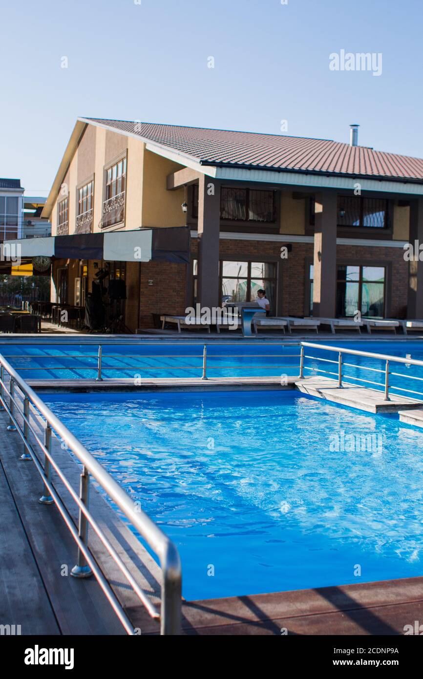 swimming pool in complex with blue water Stock Photo - Alamy