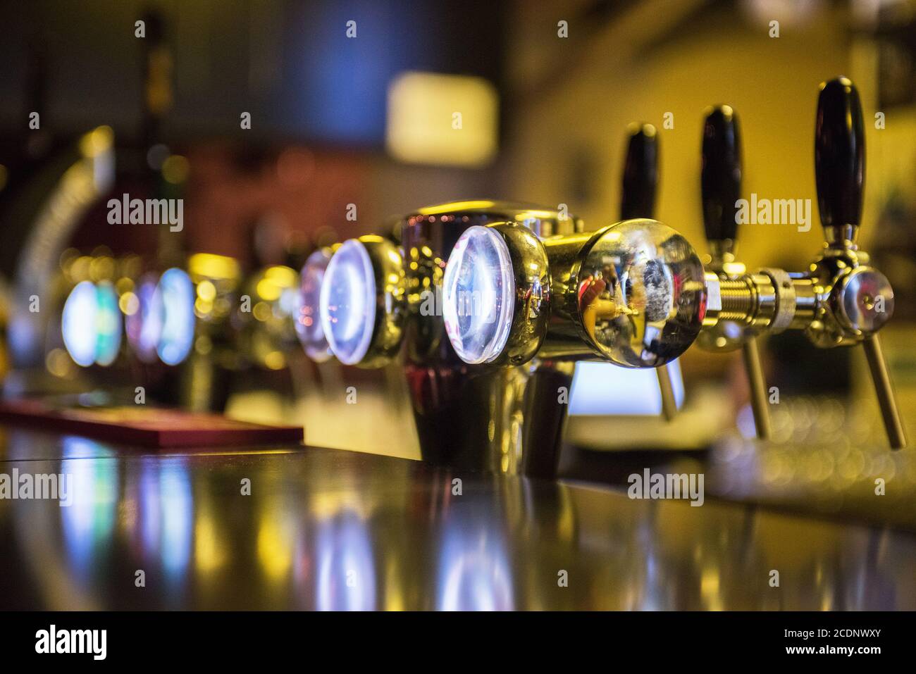 Metallic beer taps Stock Photo - Alamy