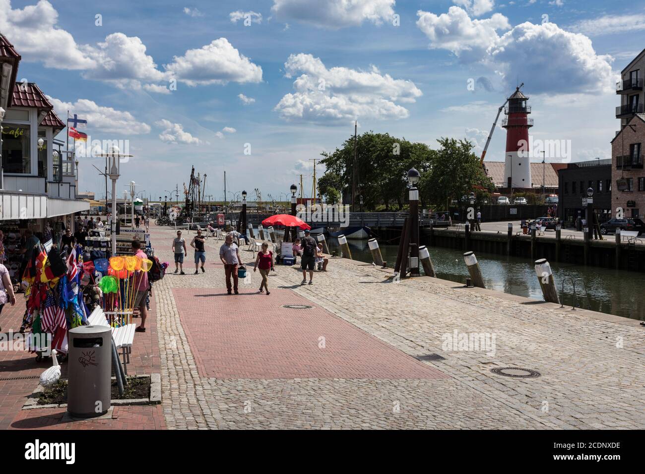 Busum at the harbor with the lighthouse in the background Stock Photo ...