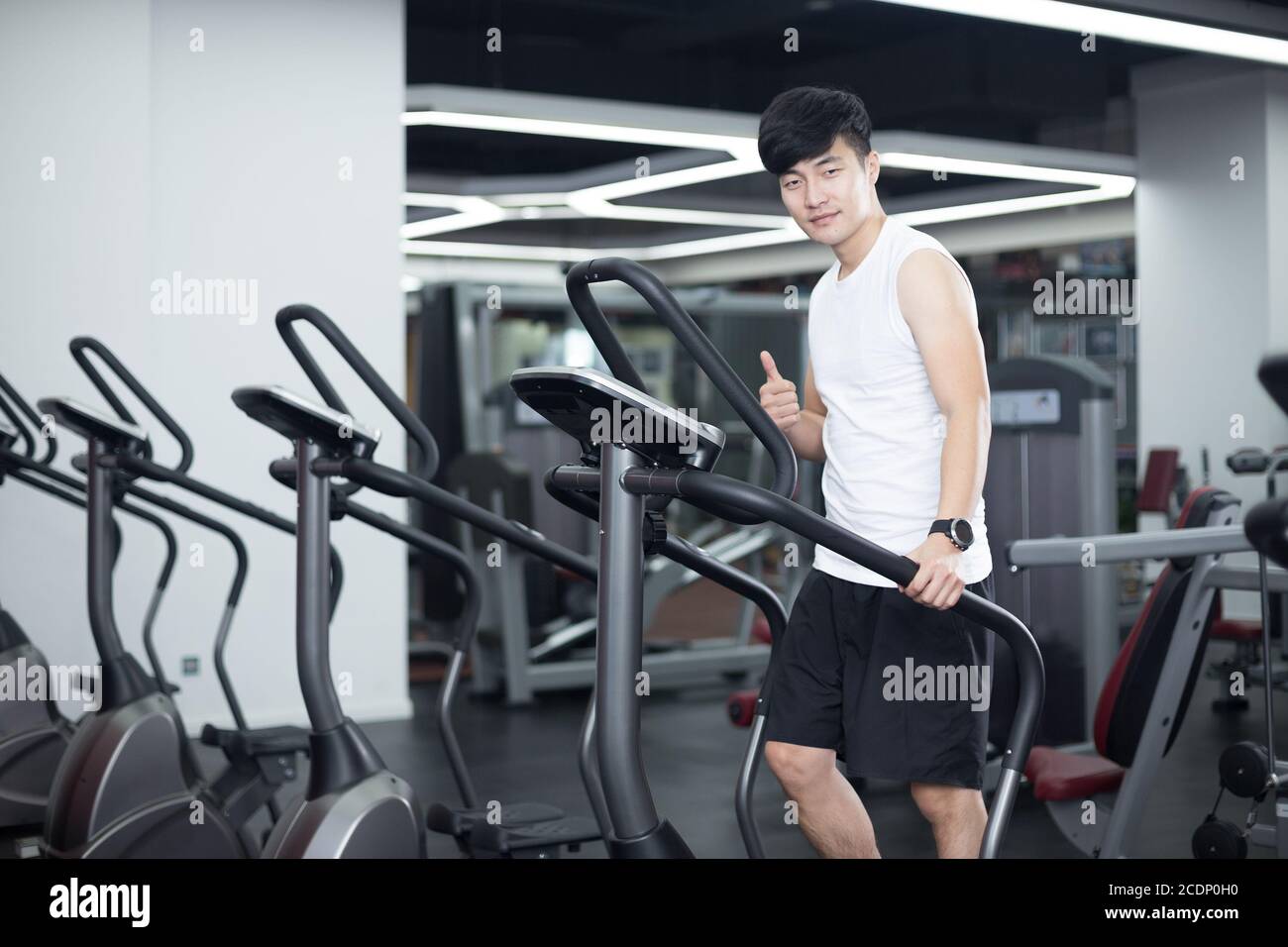 Man works out in gym hi-res stock photography and images - Alamy