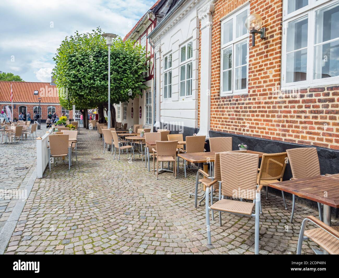Outdoor Table Area with stone brick pavement on a sunny summer ...