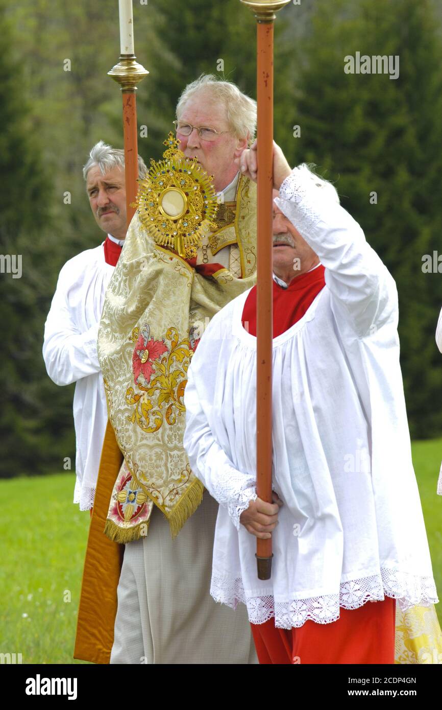 catholic priest at a procession in Bavaria Stock Photo - Alamy