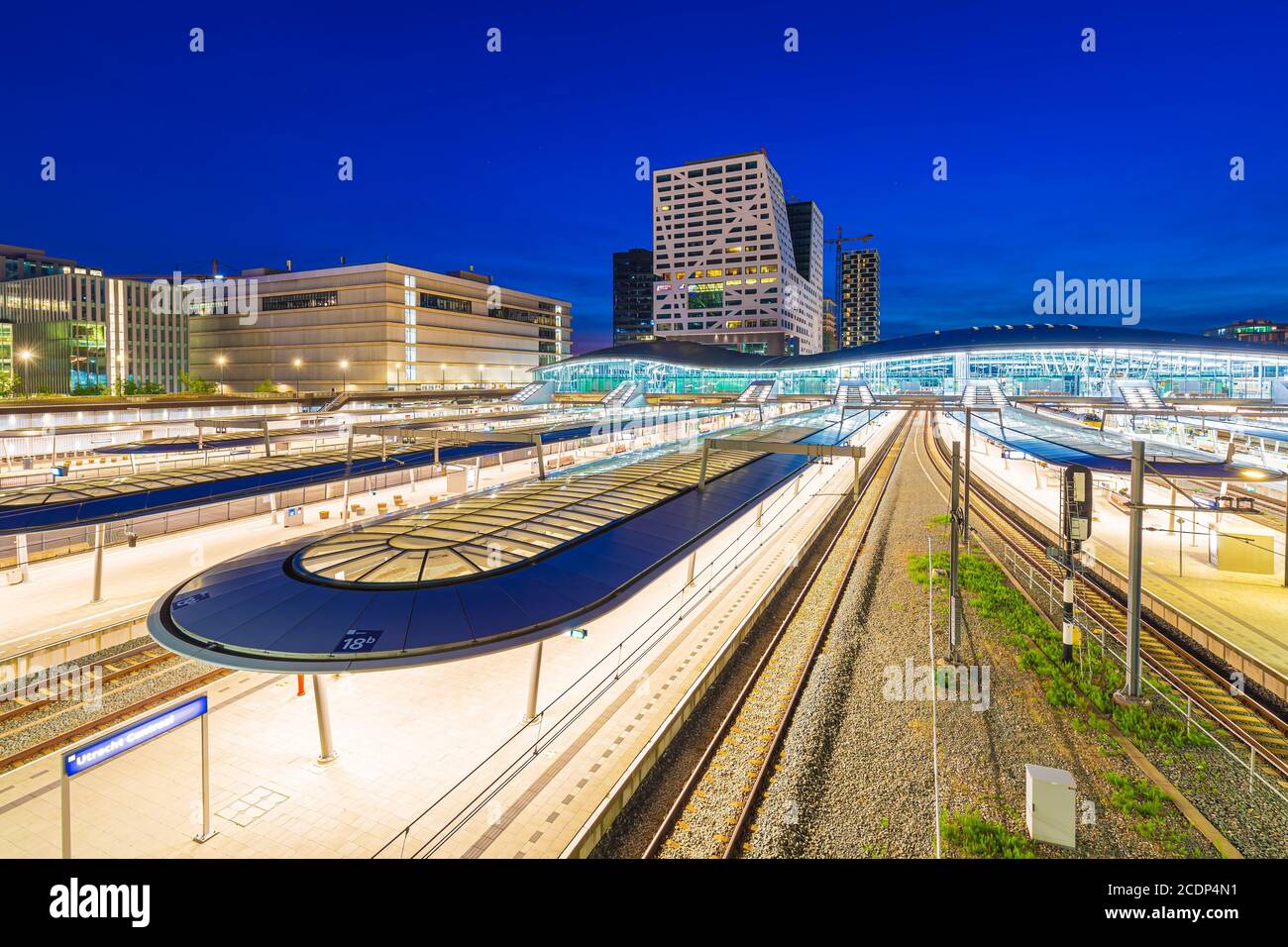 Utrecht central railway station at dusk. Modern contemporary ...