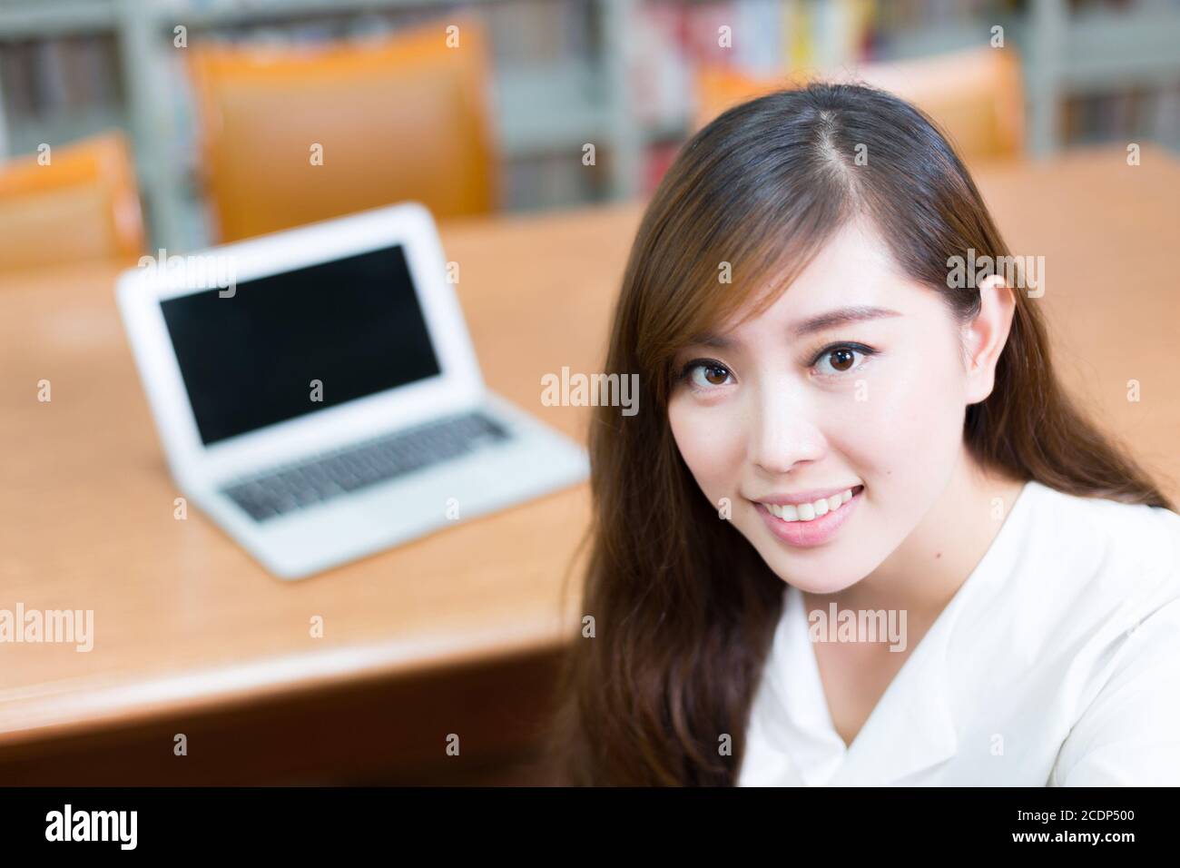 young beautiful asian girl in school library Stock Photo - Alamy