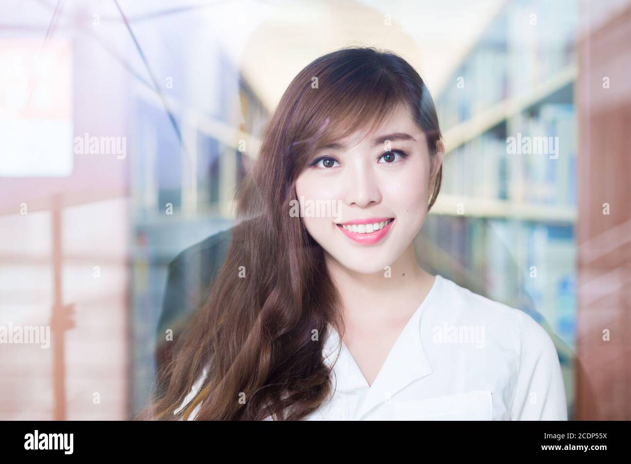 young beautiful asian girl student in library Stock Photo - Alamy