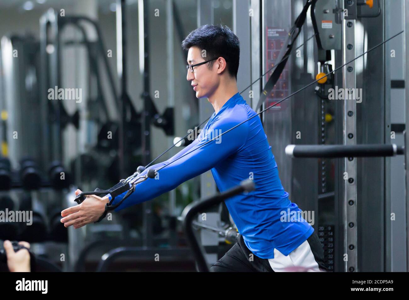 young asian man working out in modern gym Stock Photo - Alamy