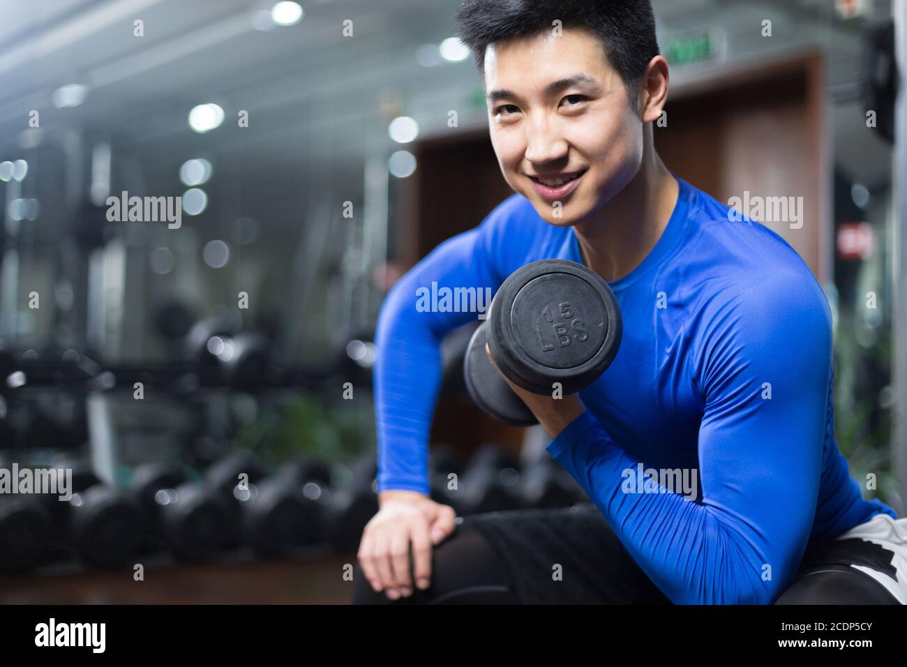 young asian man working out in modern gym Stock Photo - Alamy