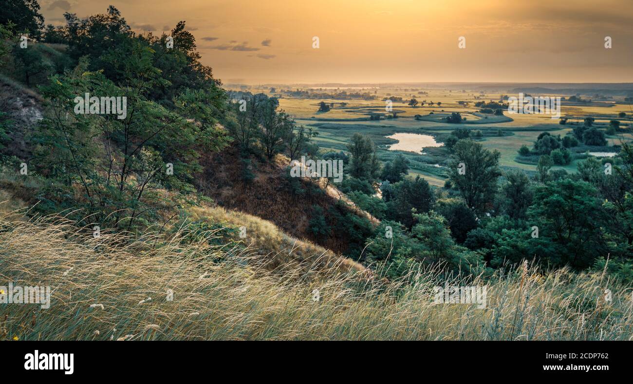 Impressive summer orange sundown sky, landscape of empty endless ...