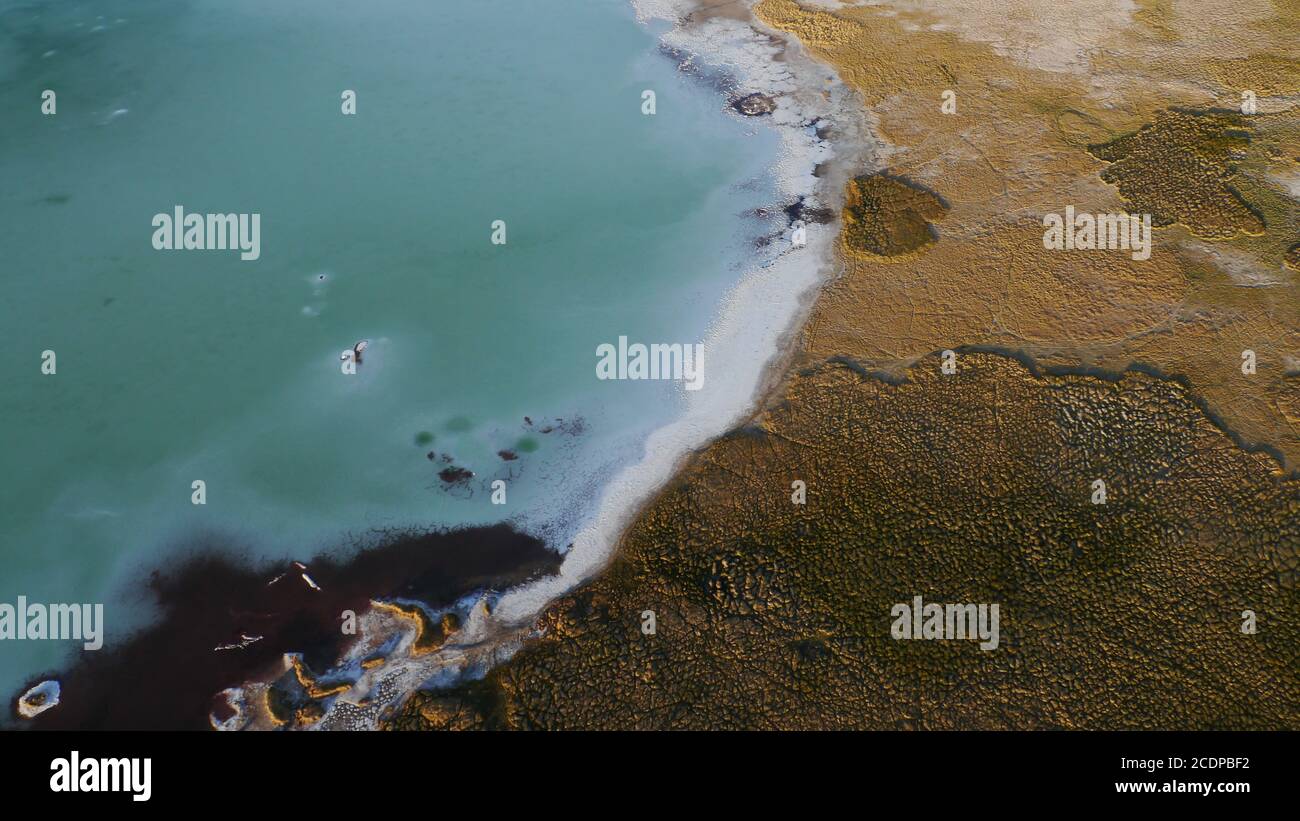 Glittering salt crystals and blue shining salt lagoons in the Atacama ...
