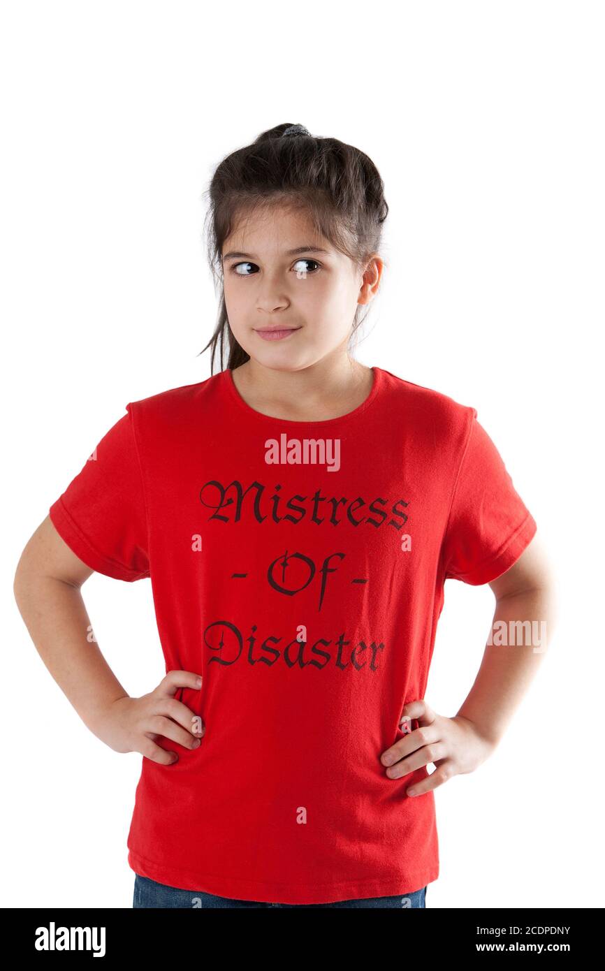 Cheeky looking young girl in a red T-shirt with cheeky slogan Stock ...