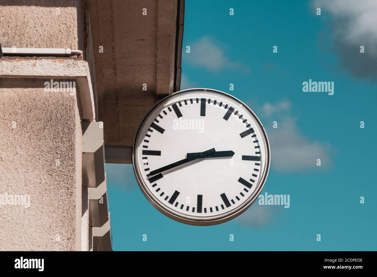 Large clock on the outside of a building. The time is 2:40 AM Stock ...