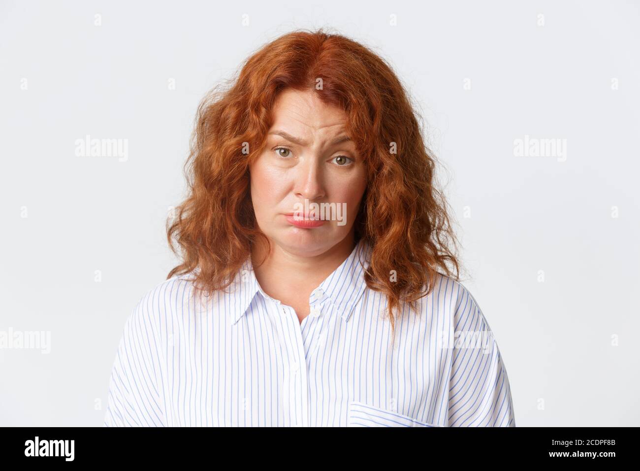 People, emotions and lifestyle concept. Unamused tired redhead middle ...