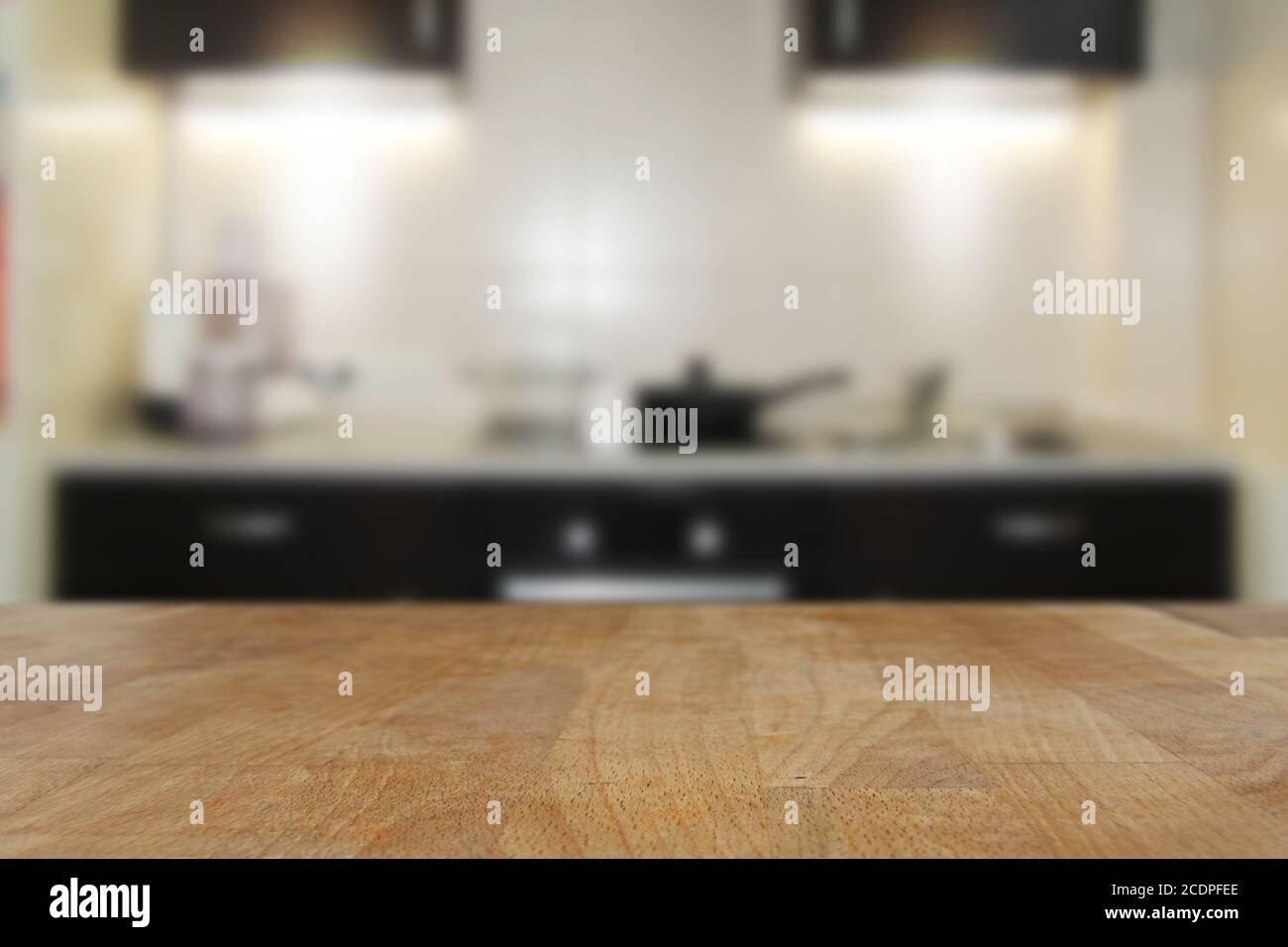 Wooden table on kitchen interior background Stock Photo - Alamy