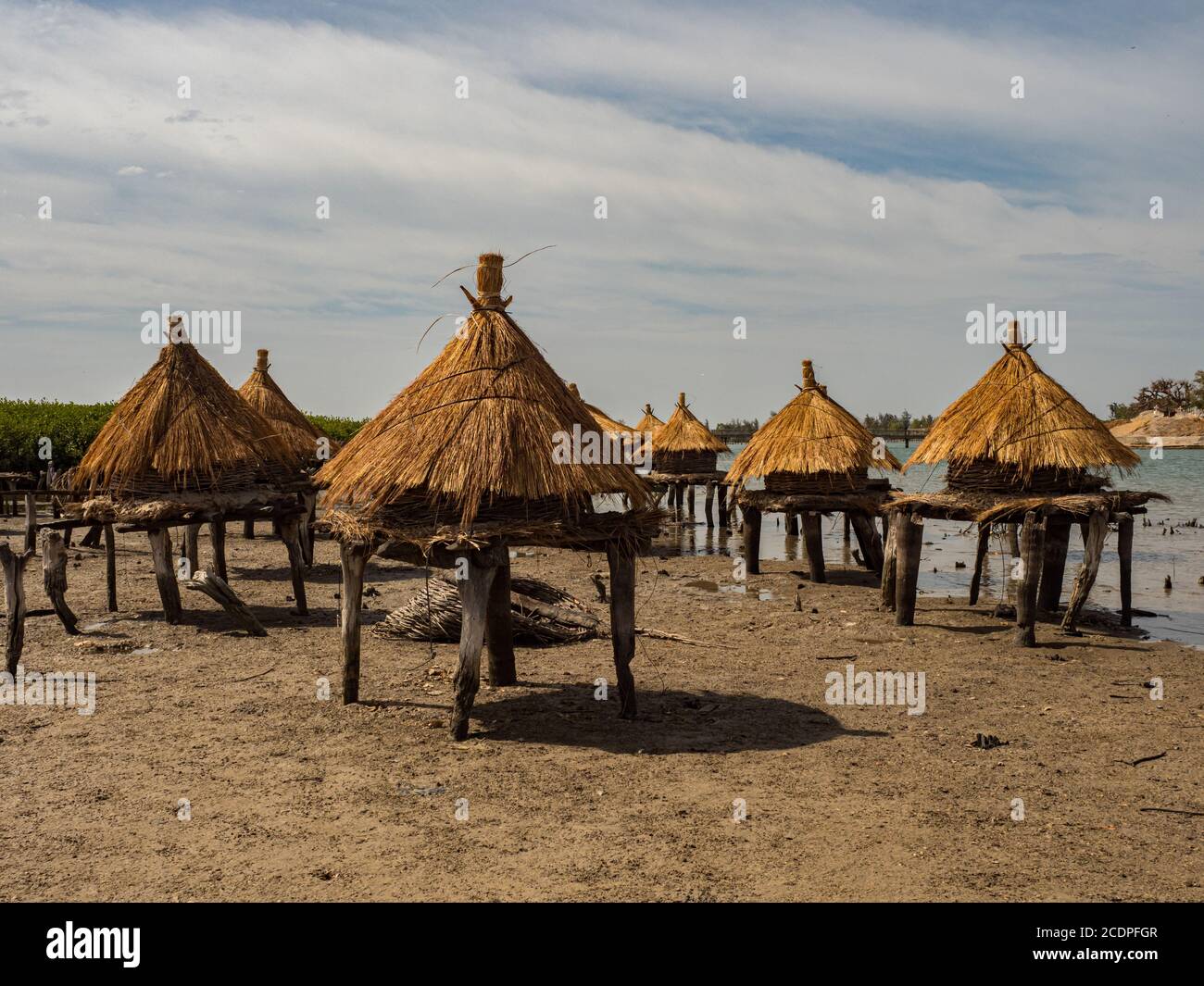 Granaries on a shell island among mangrove trees, Joal-Fadiouth ...