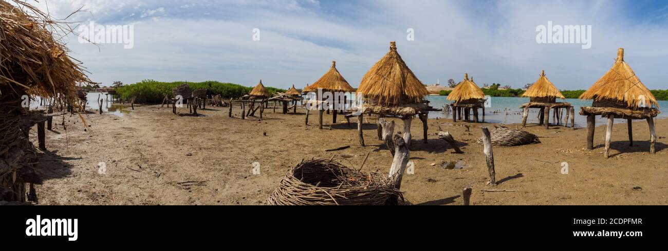 Granaries on a shell island among mangrove trees, Joal-Fadiouth ...