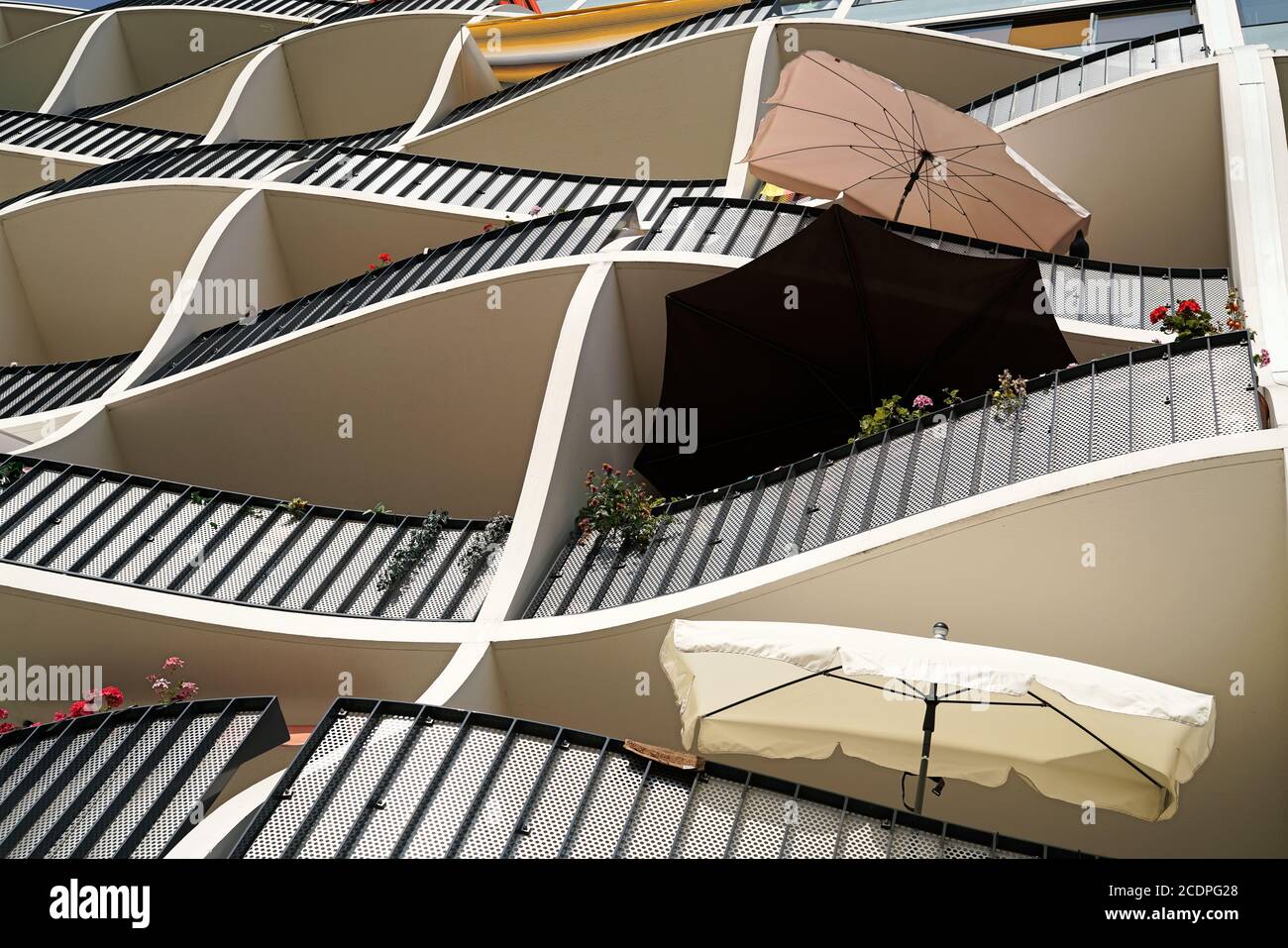 Facade of a residential building with balconies in the center of ...