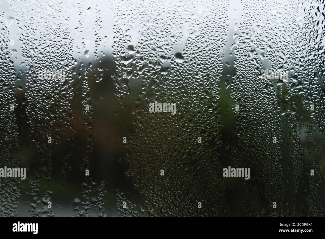 Rain droplets on a window Stock Photo - Alamy