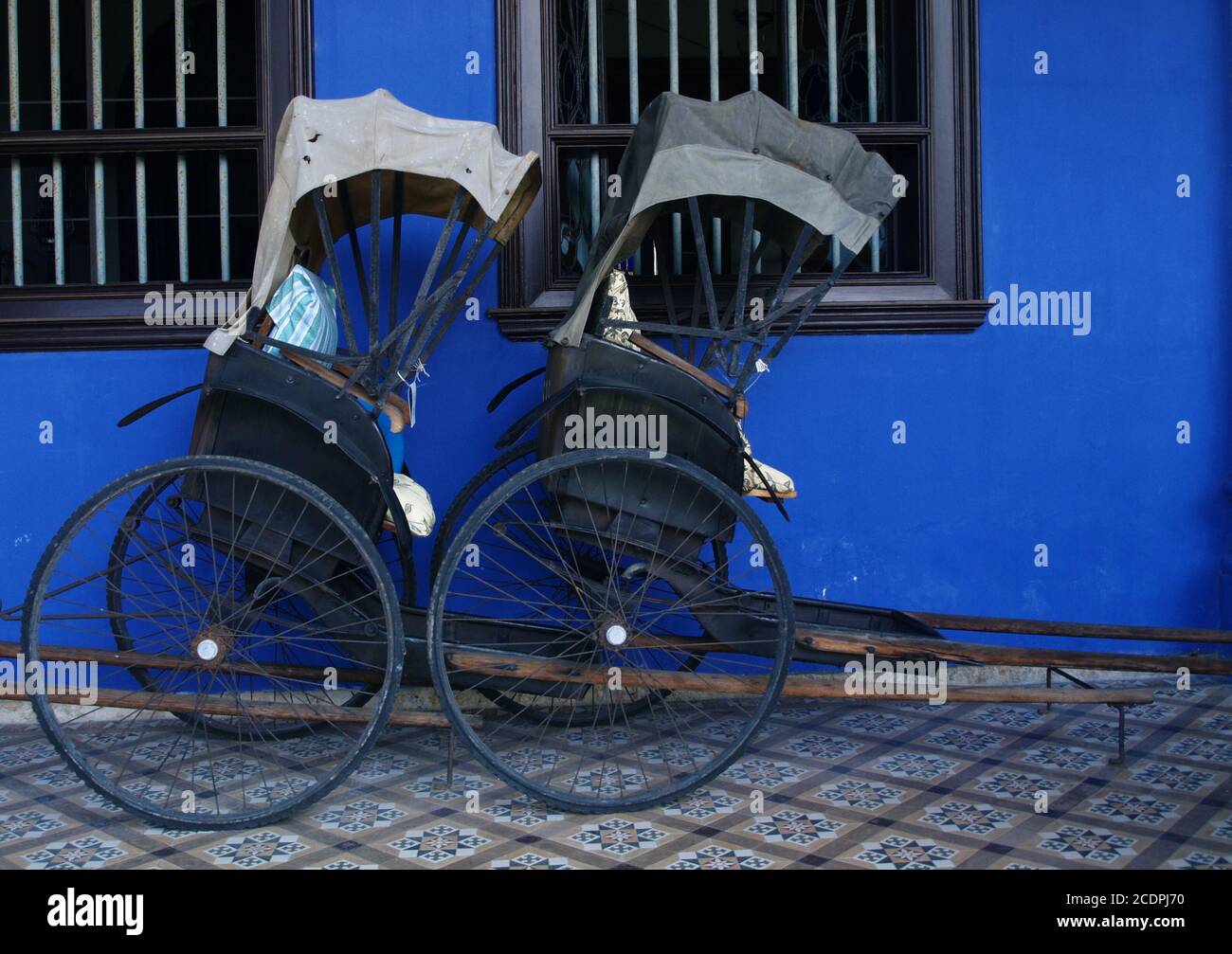 Traditional vintage rickshaws outside the Blue Mansion in Georgetown ...