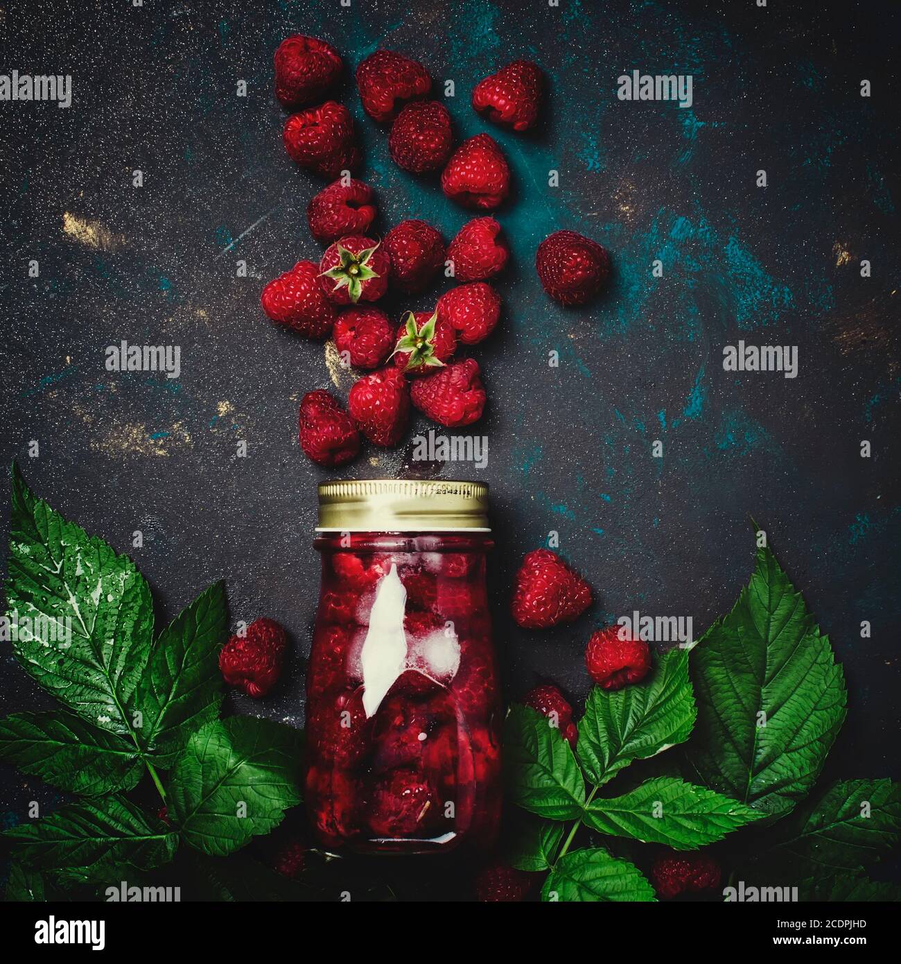 Raspberry cold drink in glass bottle, top view Stock Photo - Alamy